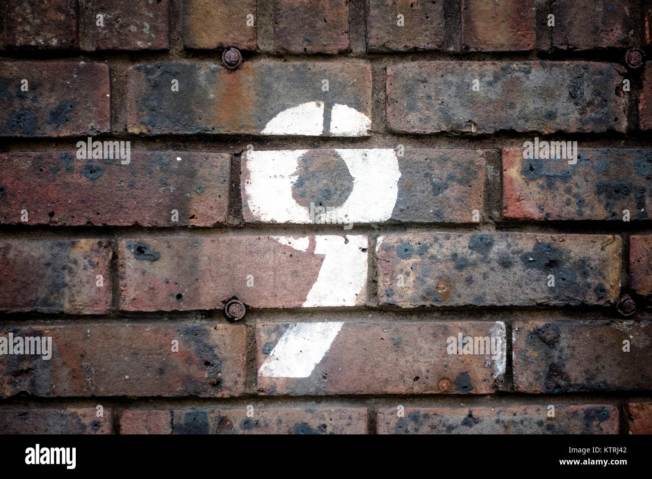 The number nine painted on a brick wall Stock Photo - Alamy