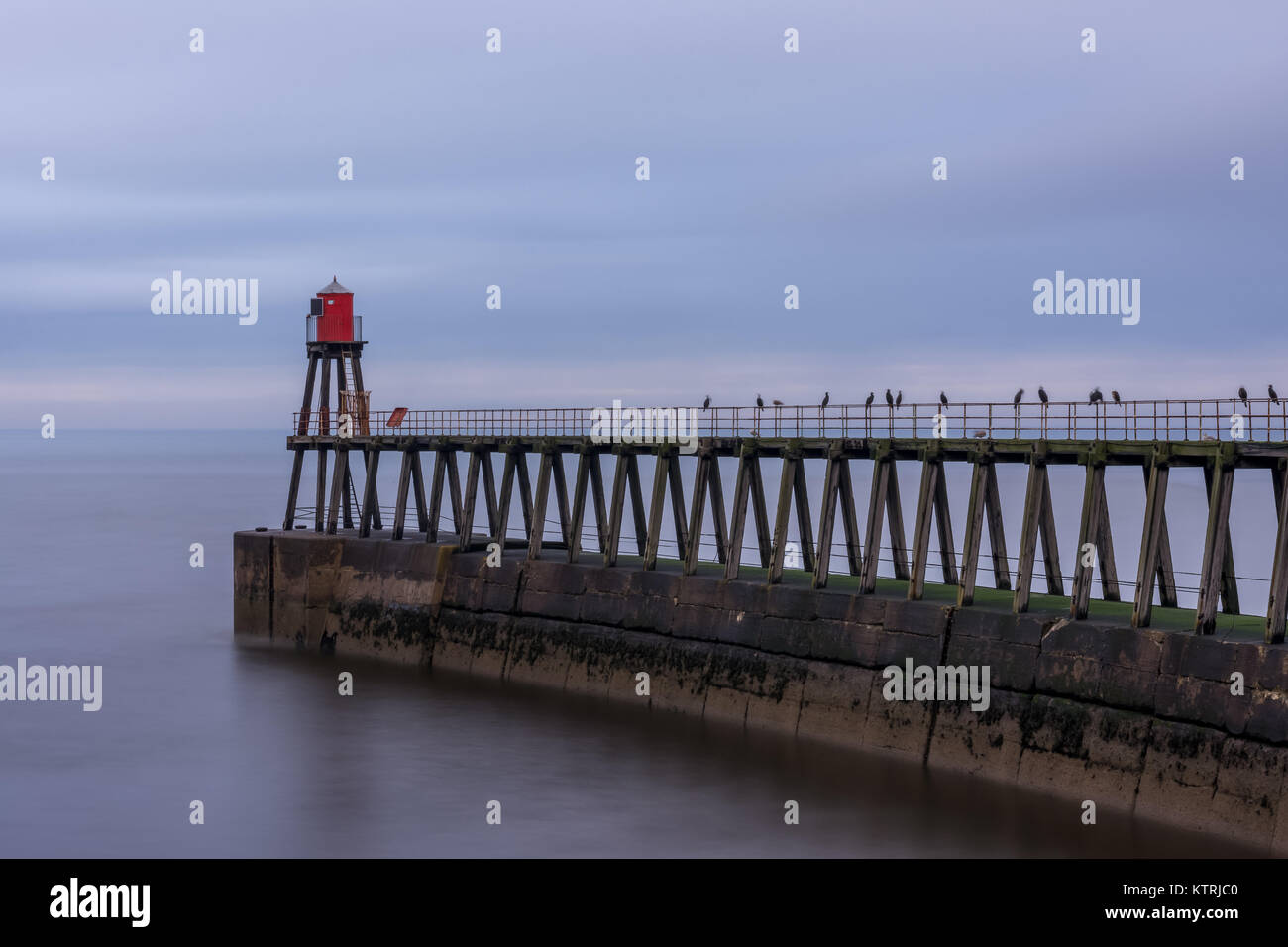 Whitby harbour entrance, east pier and beacon, North Yorkshire, England ...