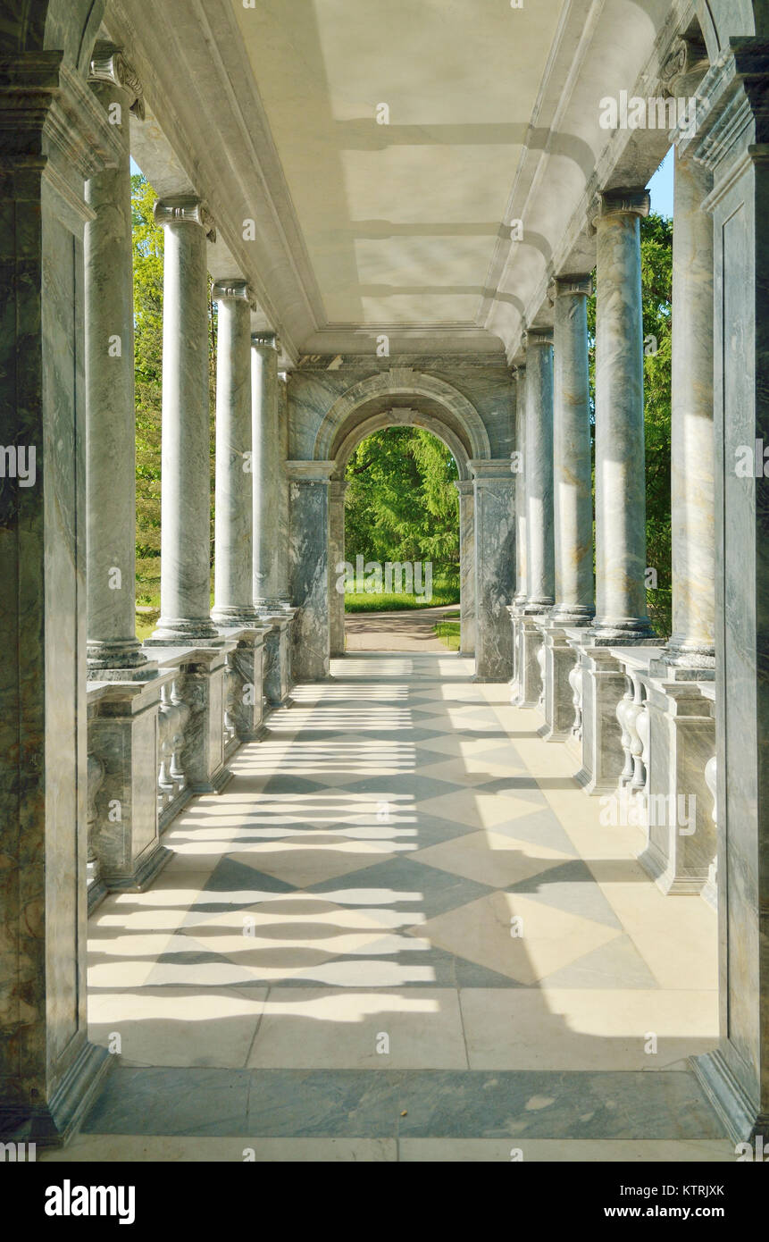 A beautiful marble bridge on the lake has a classic architectural ...