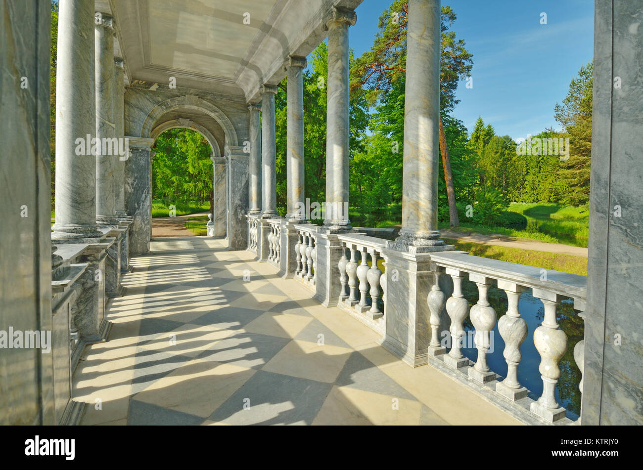 A beautiful marble bridge on the lake has a classic architectural ...