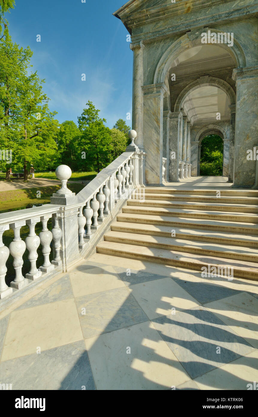 A beautiful marble bridge on the lake has a classic architectural ...