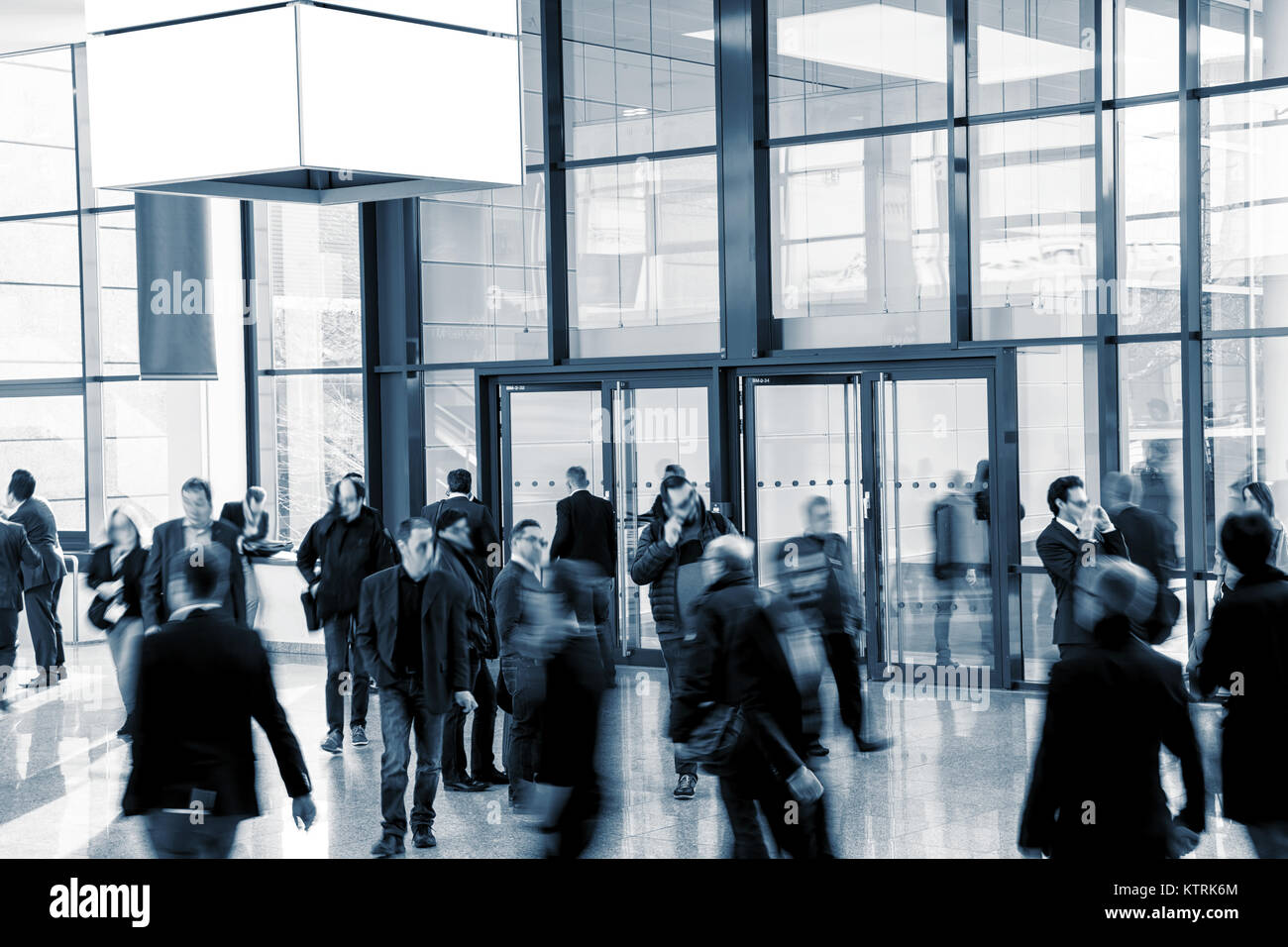 group of people in the lobby of a business Exhibition Stock Photo - Alamy