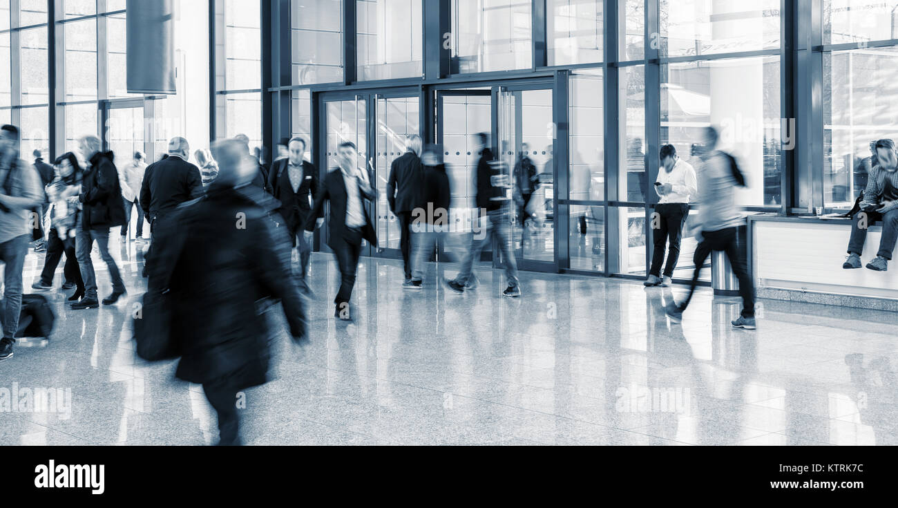 trade fair entrance with Blurred business people Stock Photo - Alamy