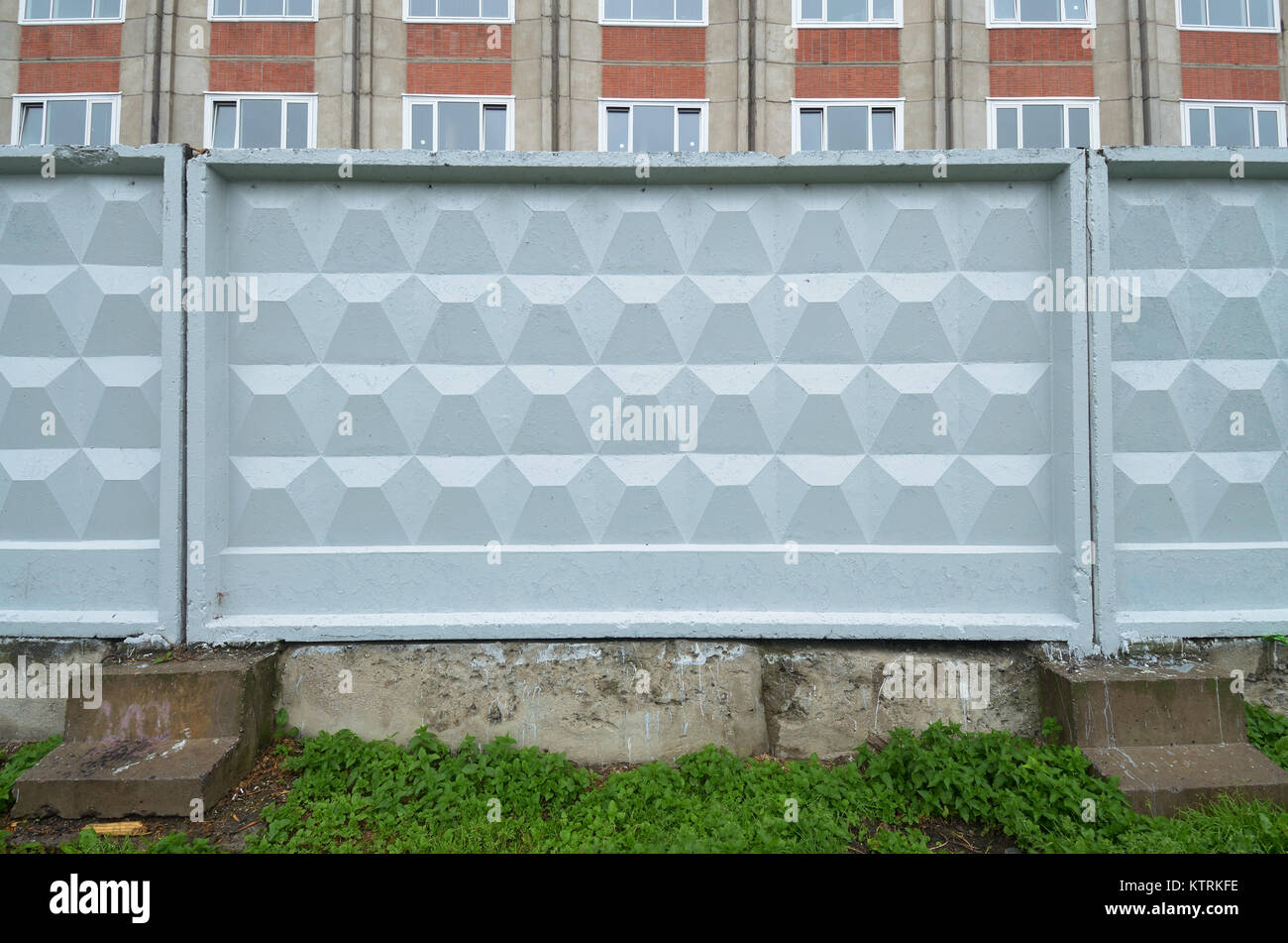 Around the factory has built a high concrete fence Stock Photo - Alamy