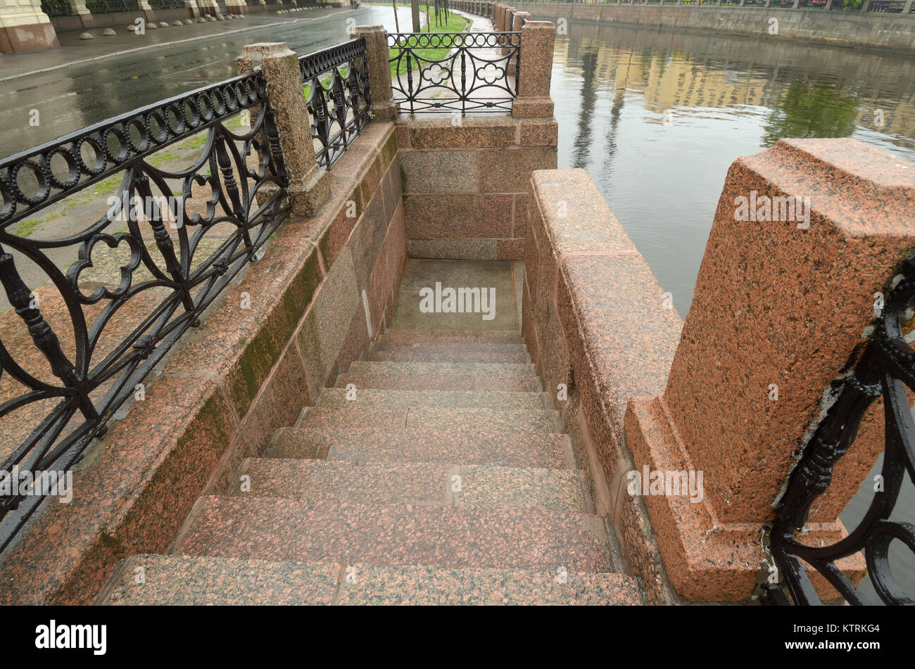 Embankment of rivers and canals lined with large granite stones Stock ...