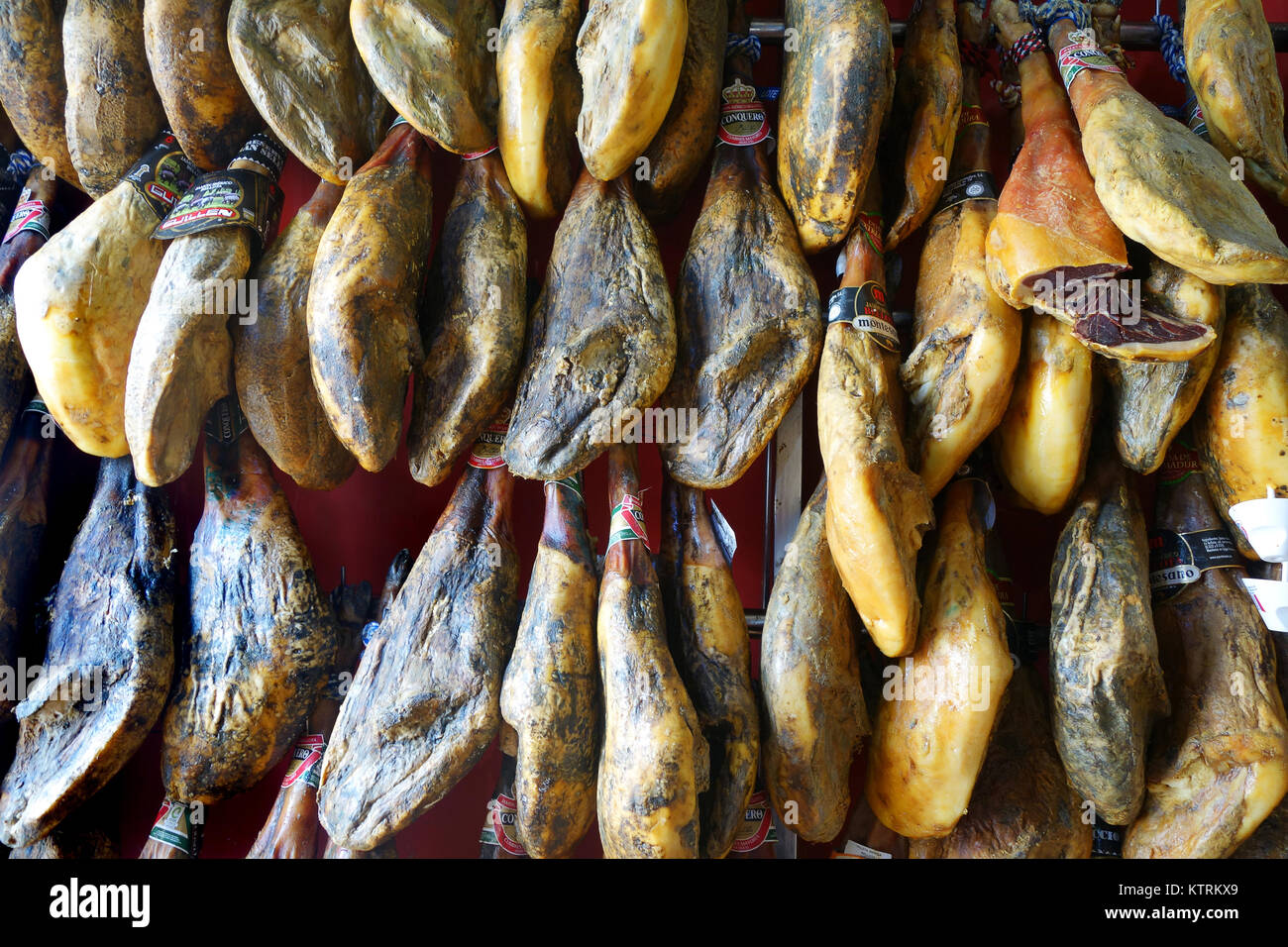 Cured hams Jamon Iberico iberian Ham Hanging Stock Photo - Alamy