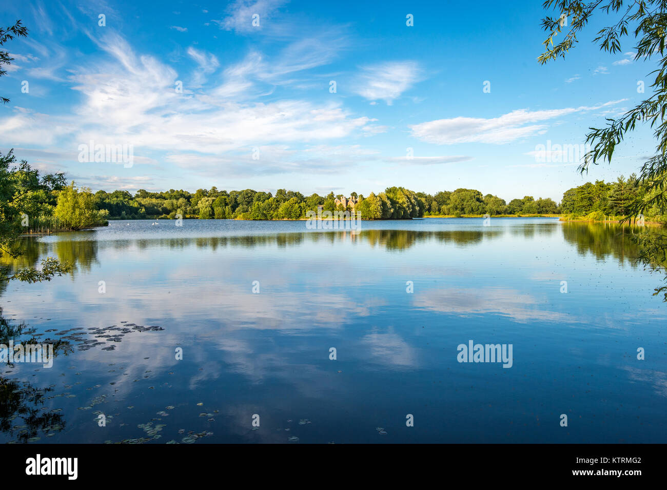Scenic view of Kiplin Hall overlooking lake with reflection, , Scorton ...