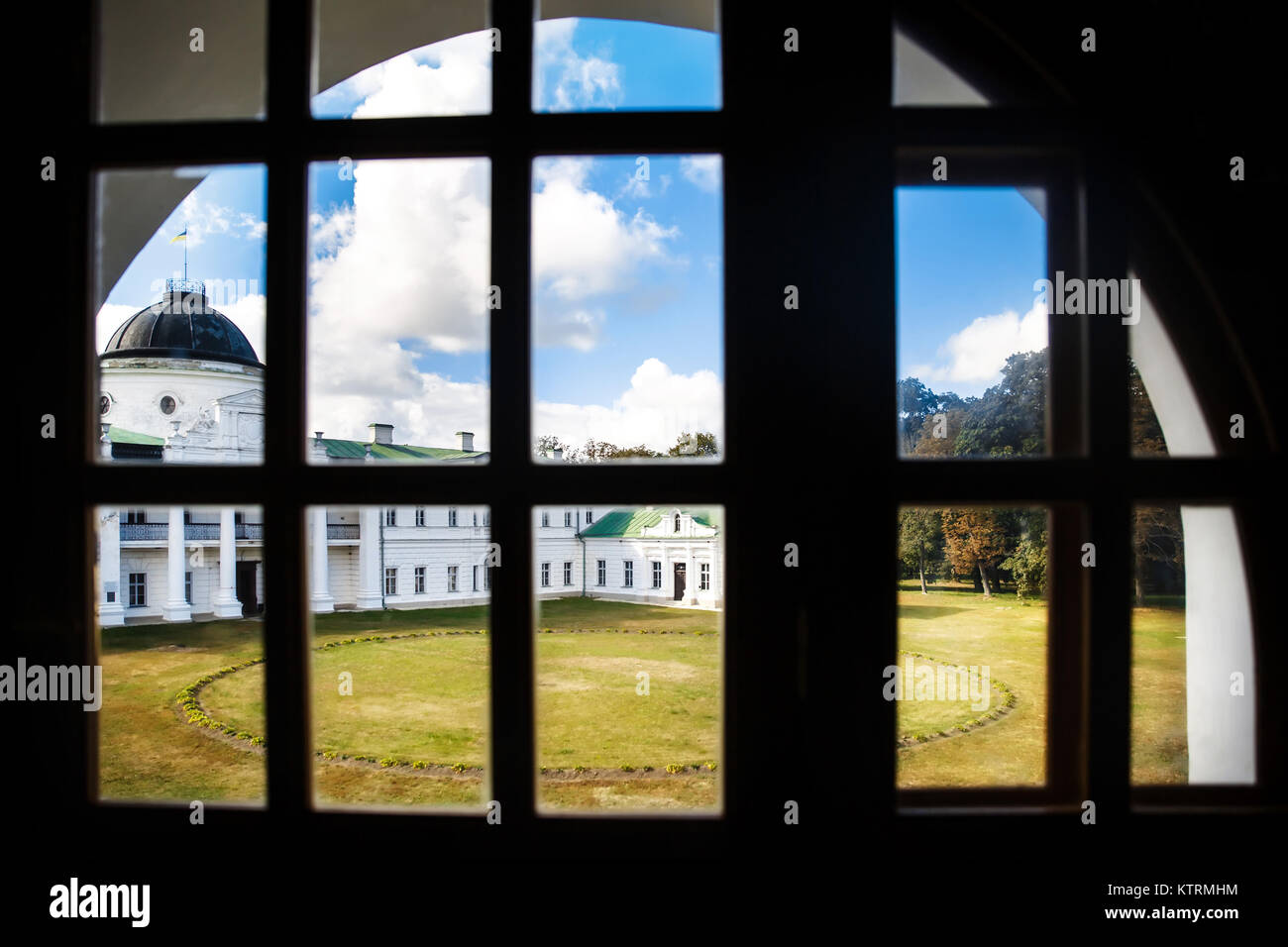 Beautiful mansion, view from the window. Around the trees and green ...