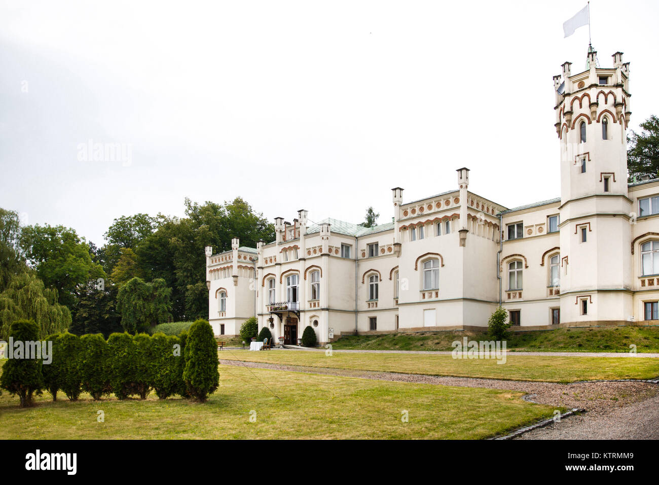 Exterior of a beautiful old house with green lawn Stock Photo - Alamy