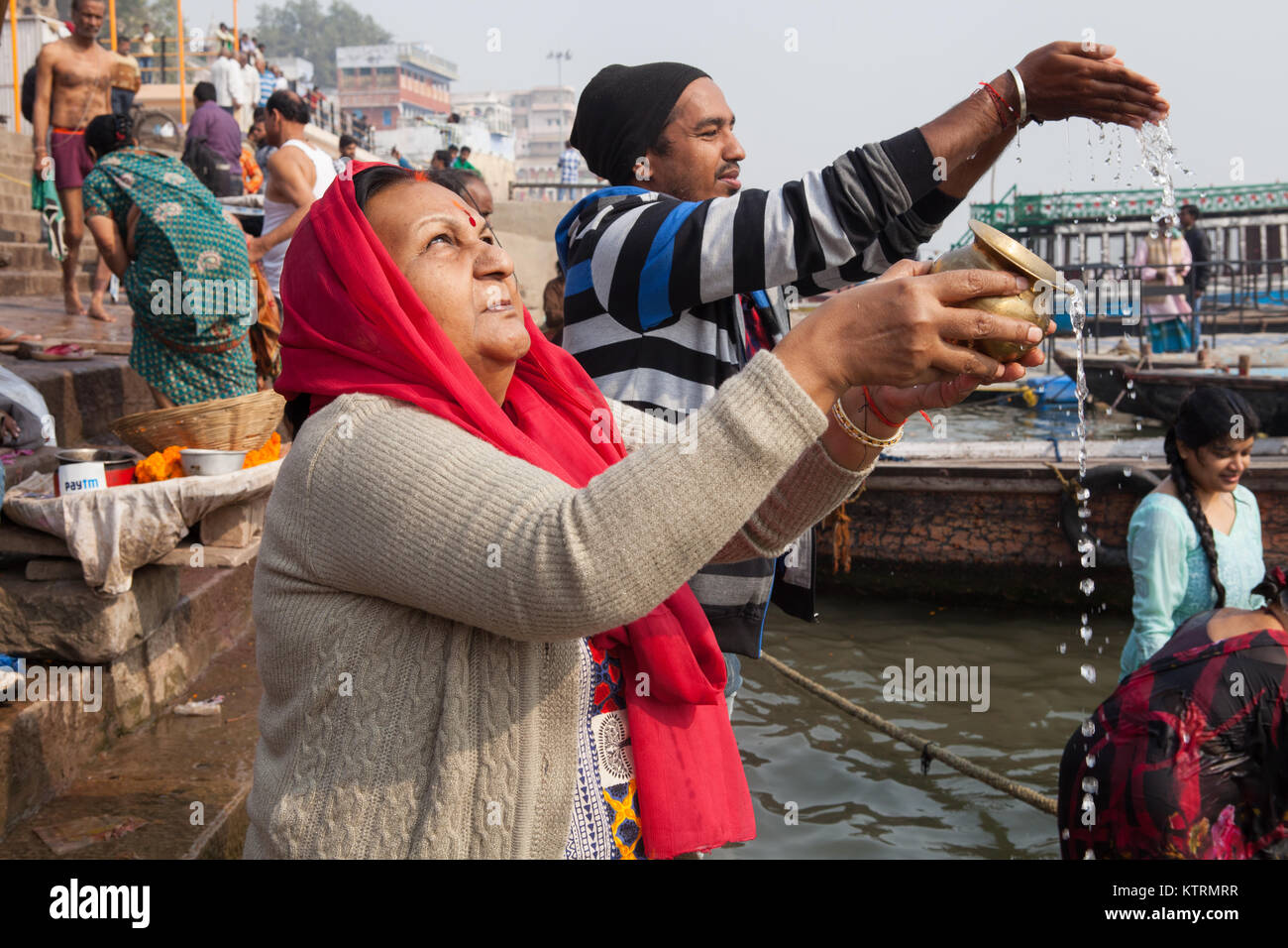 Hindu pilgrims bathing in ganges river on ghat at varanasi hi-res stock photography and images ...