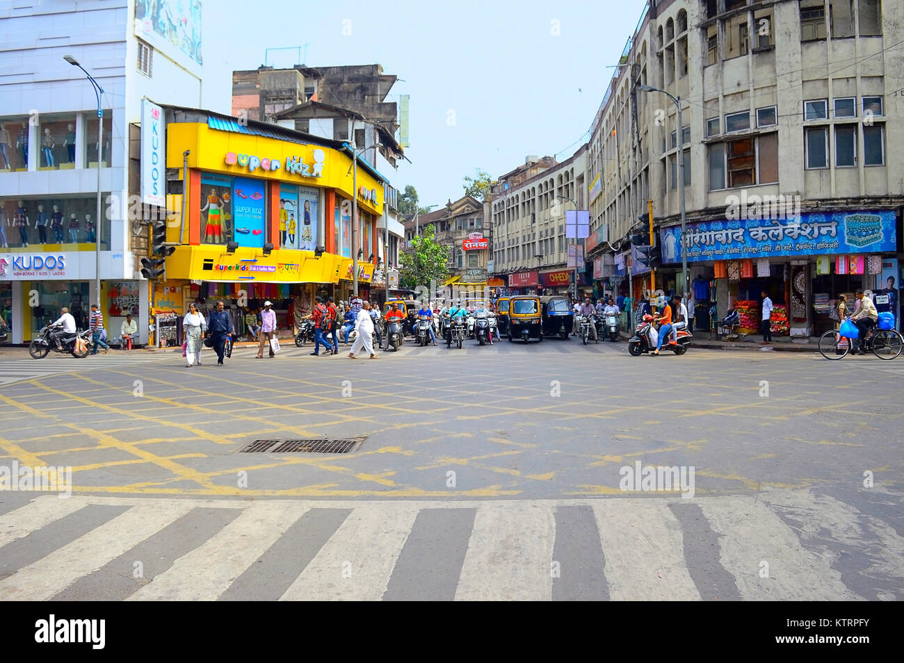 Cars and motorcycles waiting for traffic signal at Laxmi road Pune ...