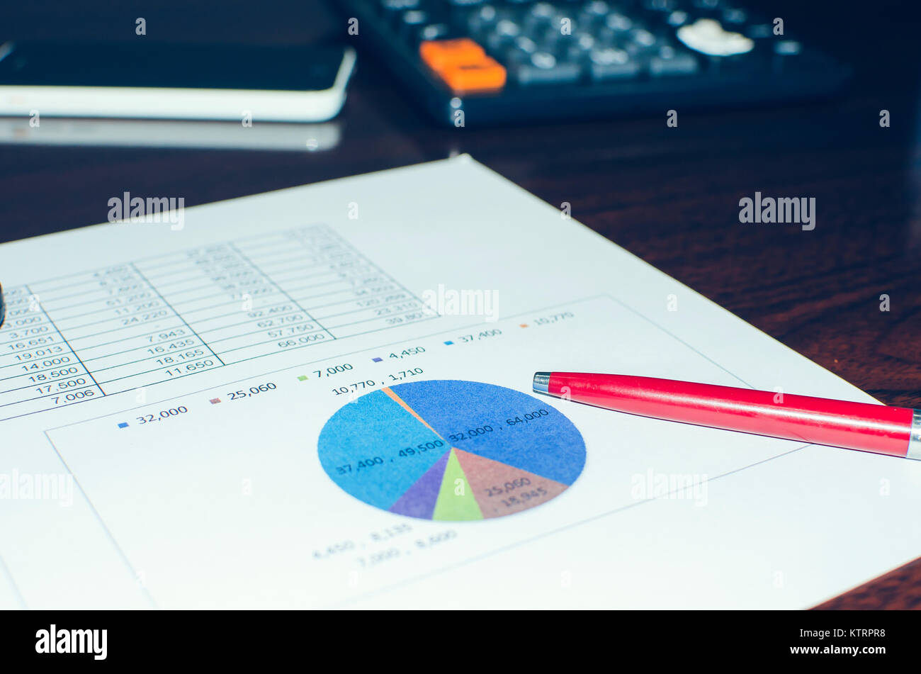 chart analysis business report on desk Stock Photo - Alamy