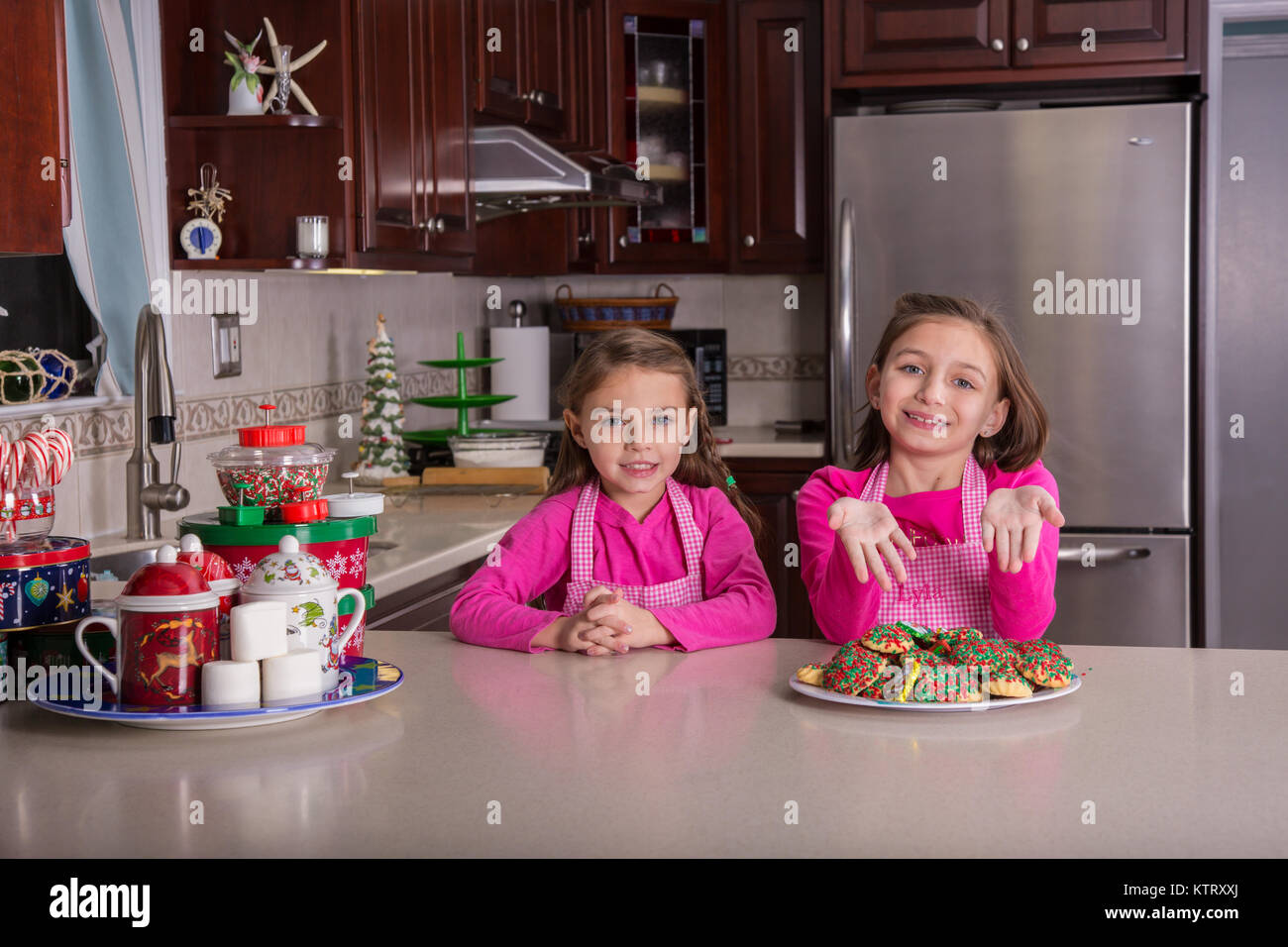 Young girls making Christmas cookies Stock Photo - Alamy