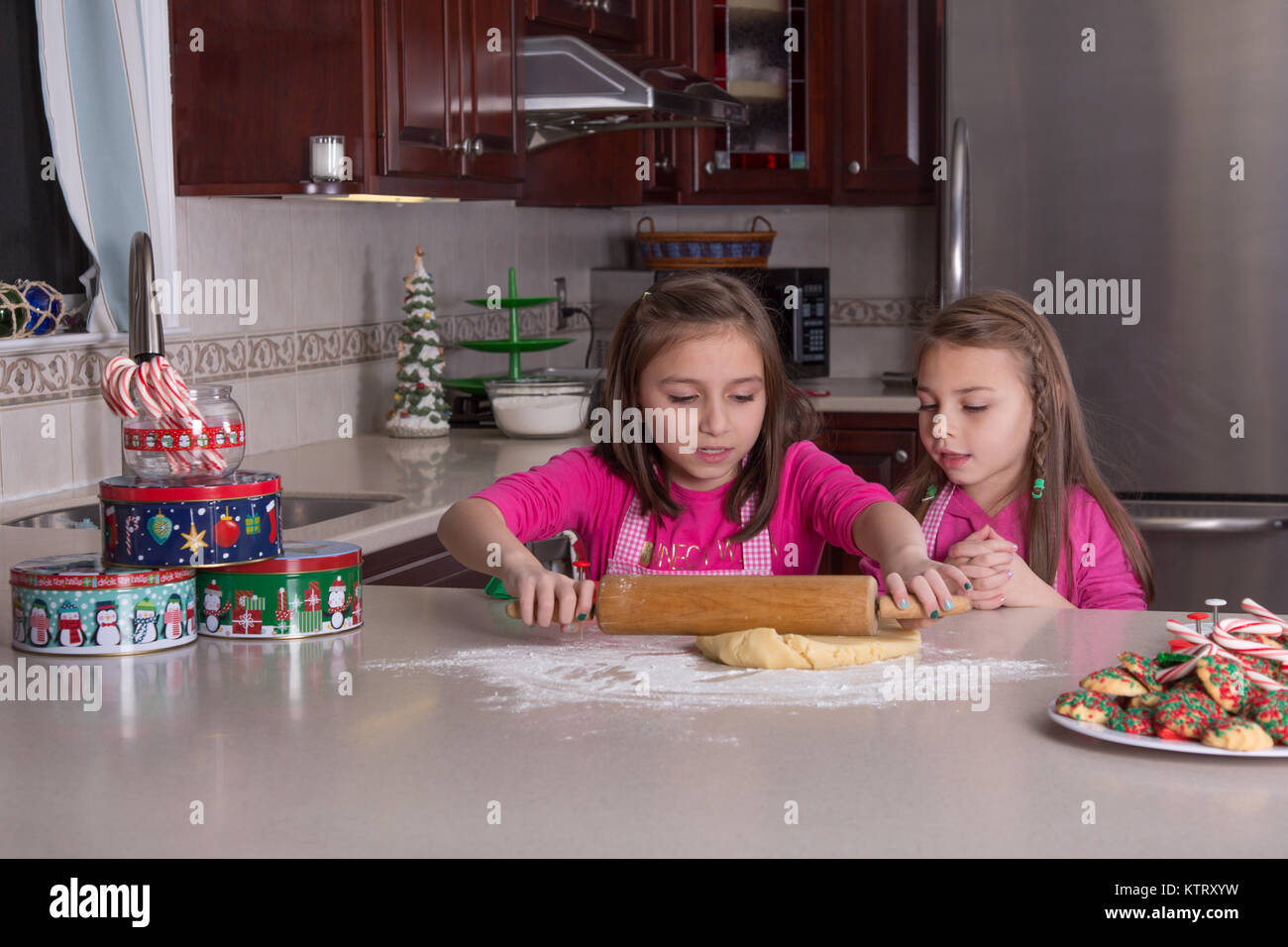 Young girls making Christmas cookies Stock Photo - Alamy