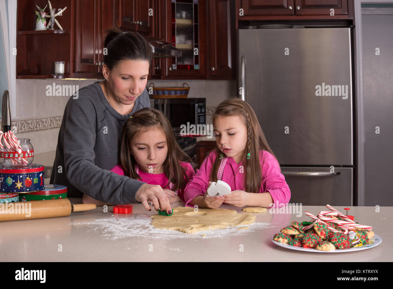 Young girls making Christmas cookies Stock Photo - Alamy