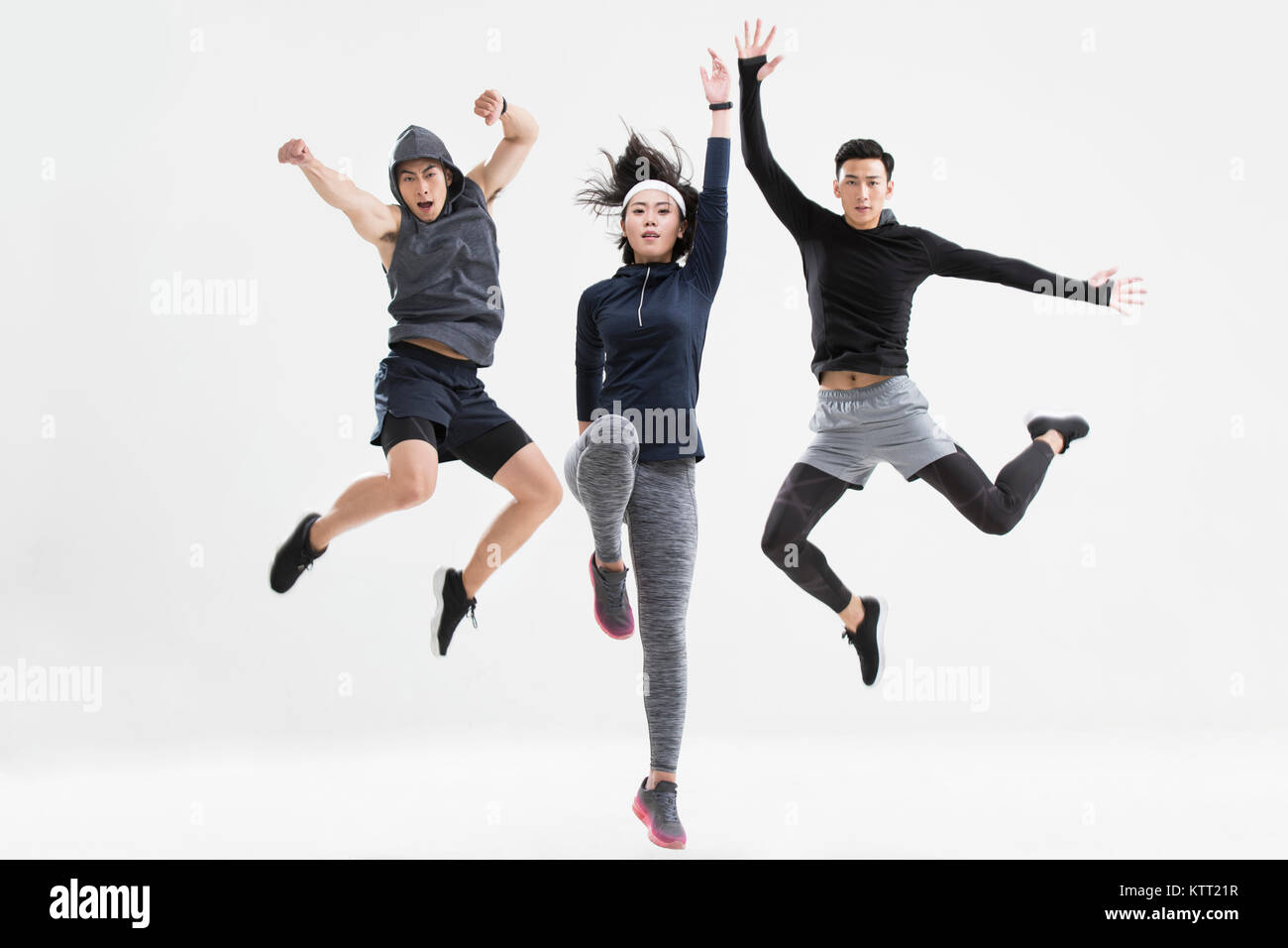 Young friends jumping Stock Photo - Alamy