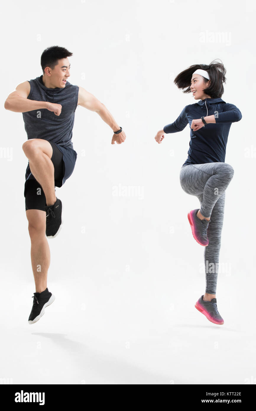 Young couple jumping Stock Photo - Alamy