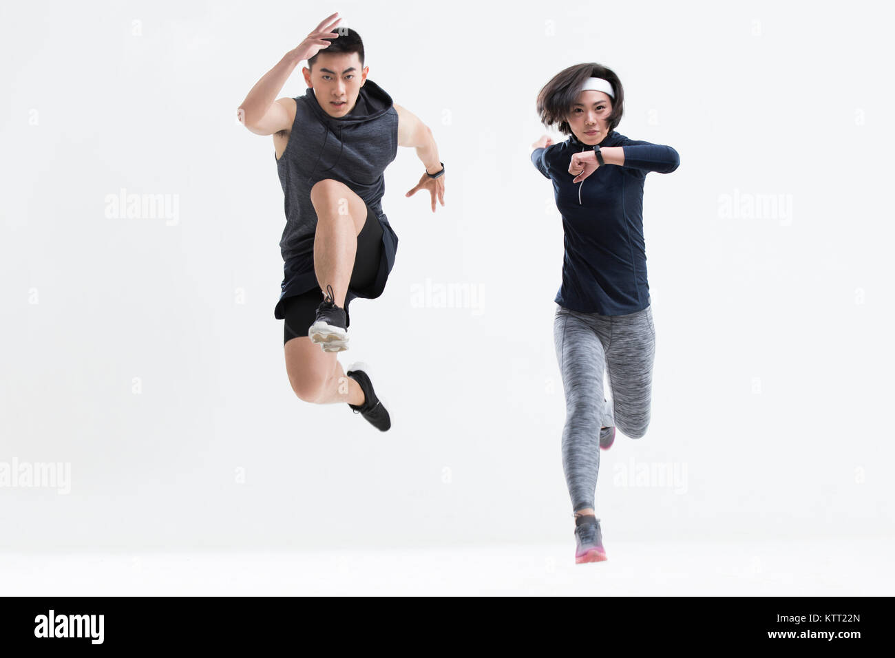 Young couple jumping Stock Photo - Alamy