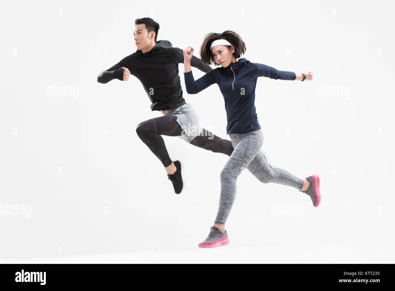 Young couple jumping Stock Photo - Alamy