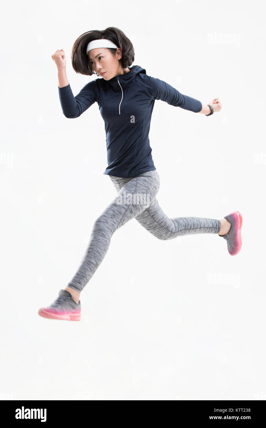 Indian young woman jumping hi-res stock photography and images - Alamy