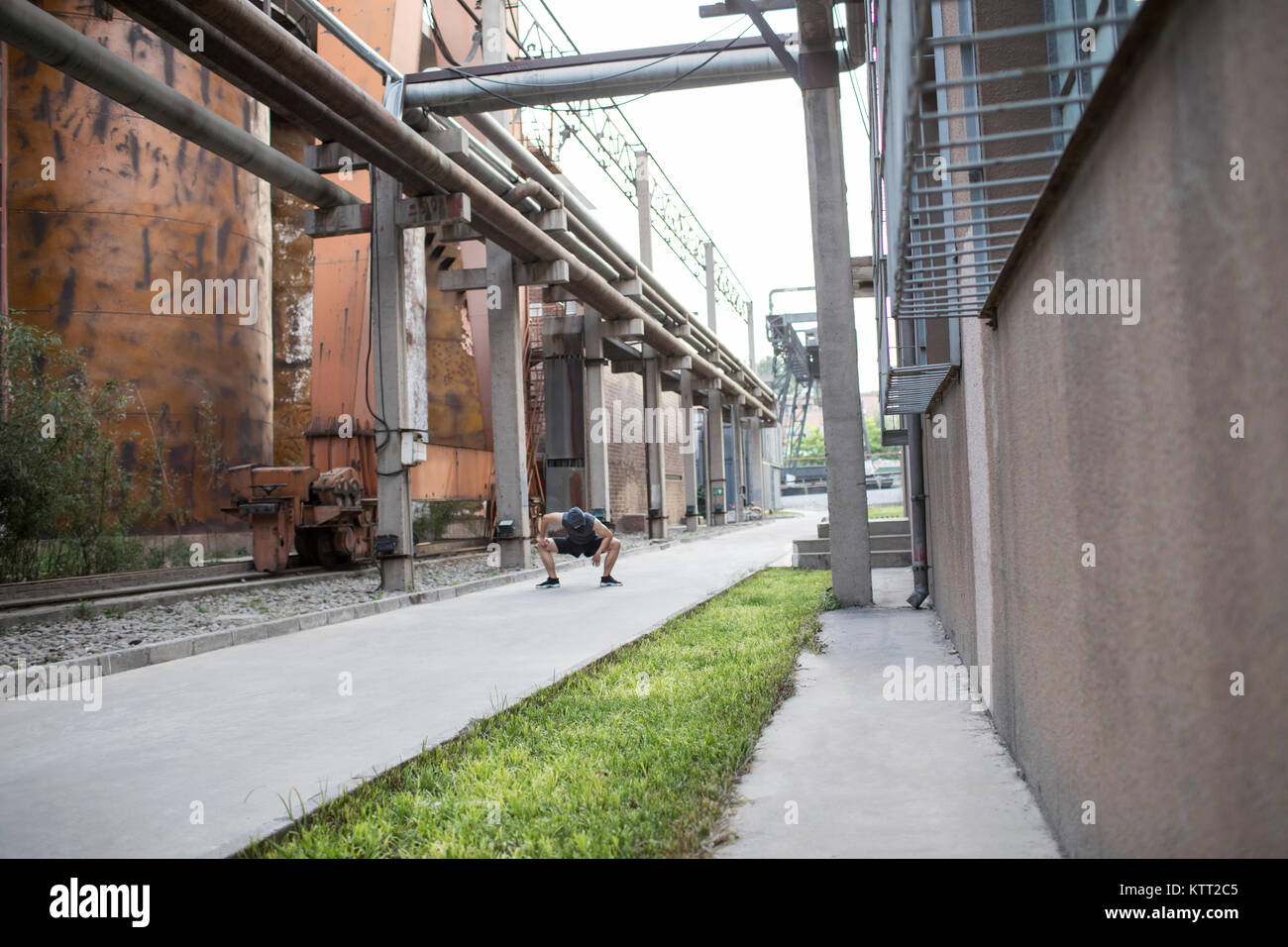 Young man resting after running Stock Photo - Alamy Young man resting after running Stock Photo - Alamy