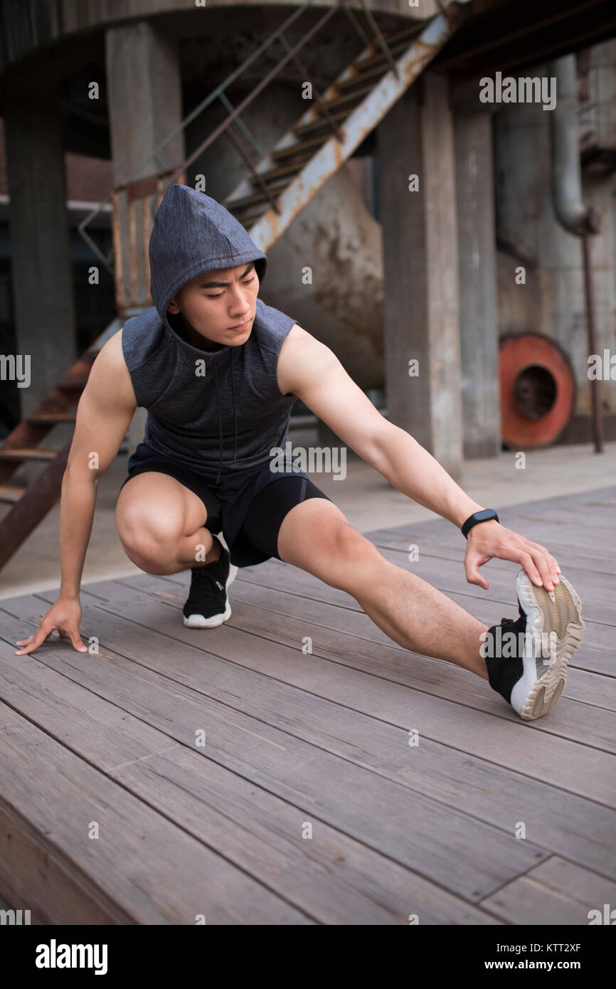 Young man exercising outdoors Stock Photo - Alamy