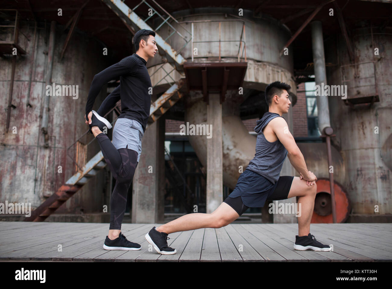 Young men exercising outdoors Stock Photo - Alamy
