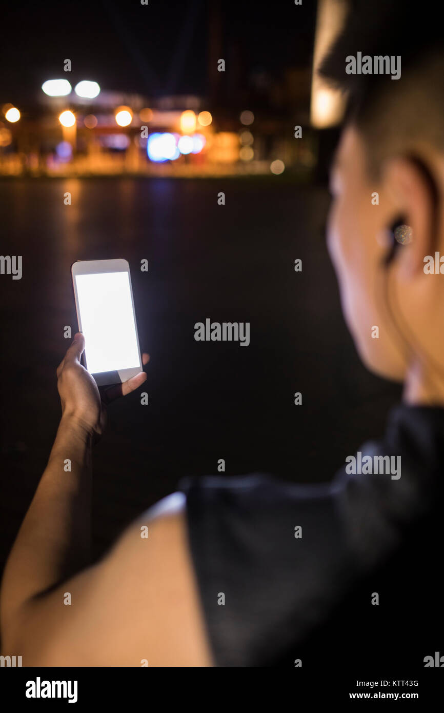 Young man using smart phone Stock Photo - Alamy
