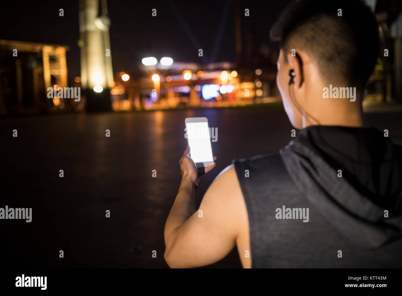 Young man using smart phone Stock Photo - Alamy