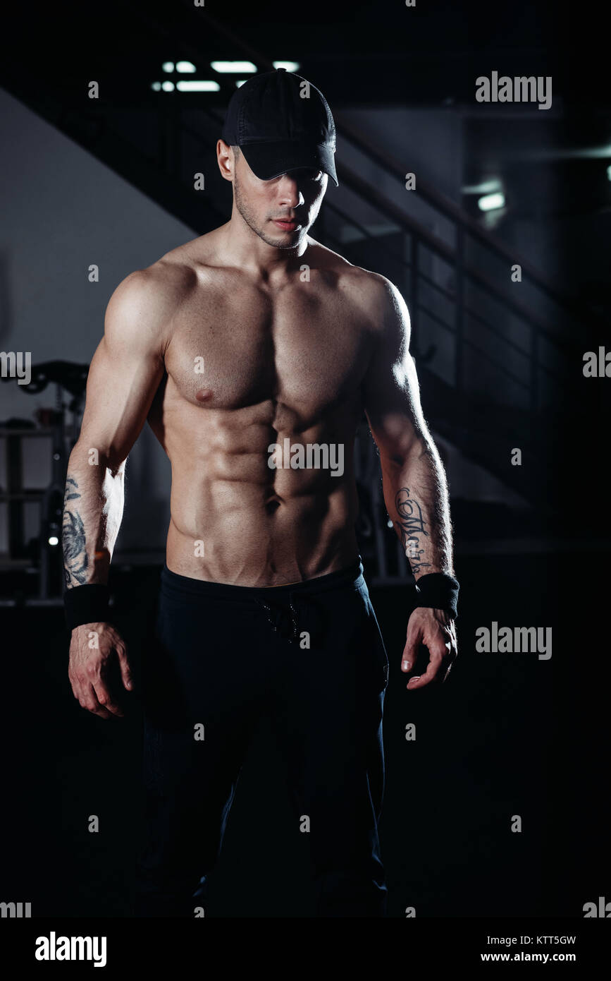 Portrait of a shirtless man in a gym Stock Photo - Alamy