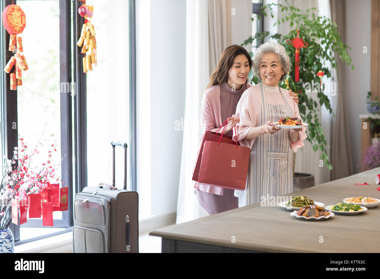 Young daughter visiting her mother during Chinese new year Stock Photo ...