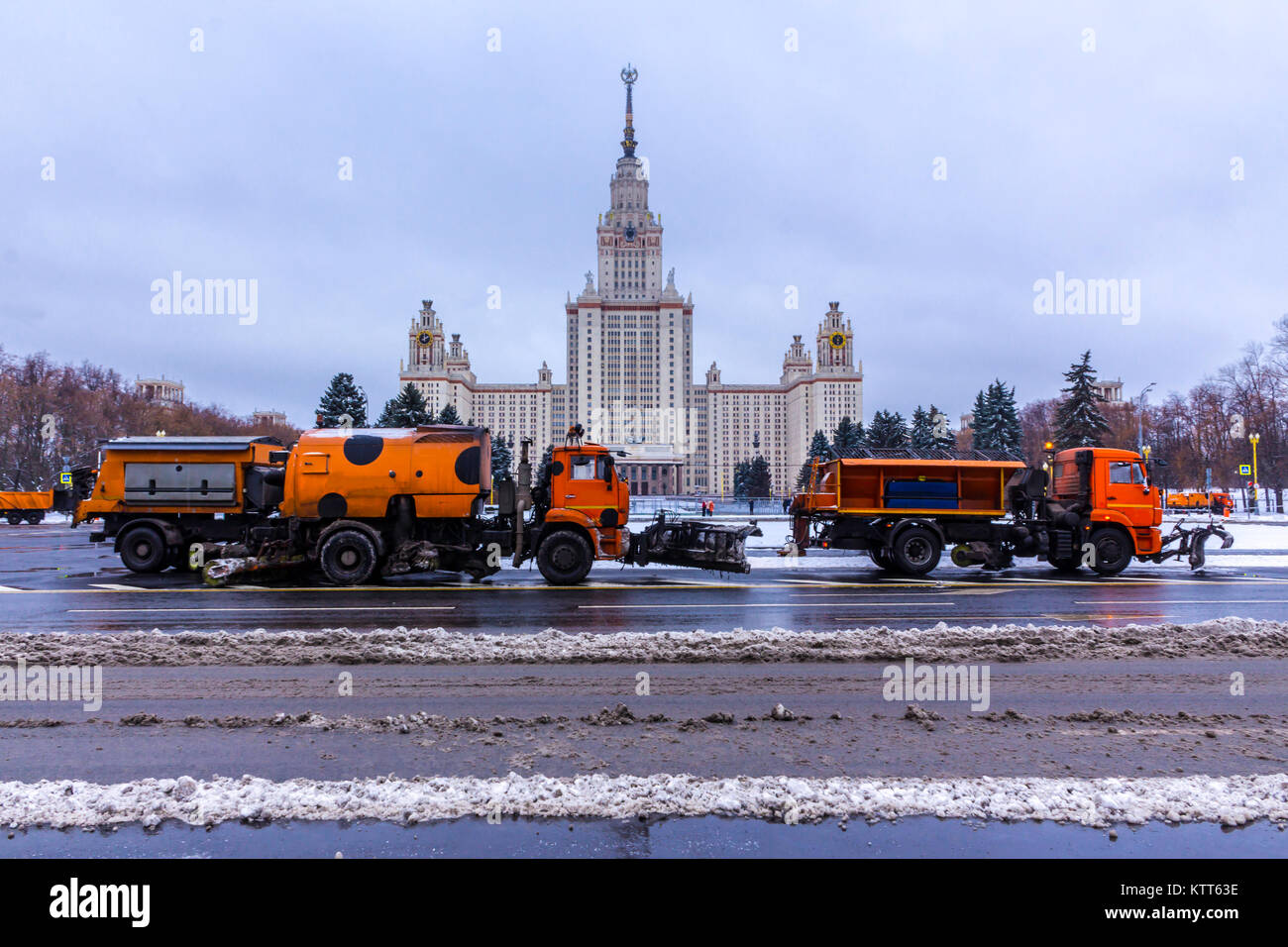 Mashines cleaning snow from the streets. Tank with a reagent that ...