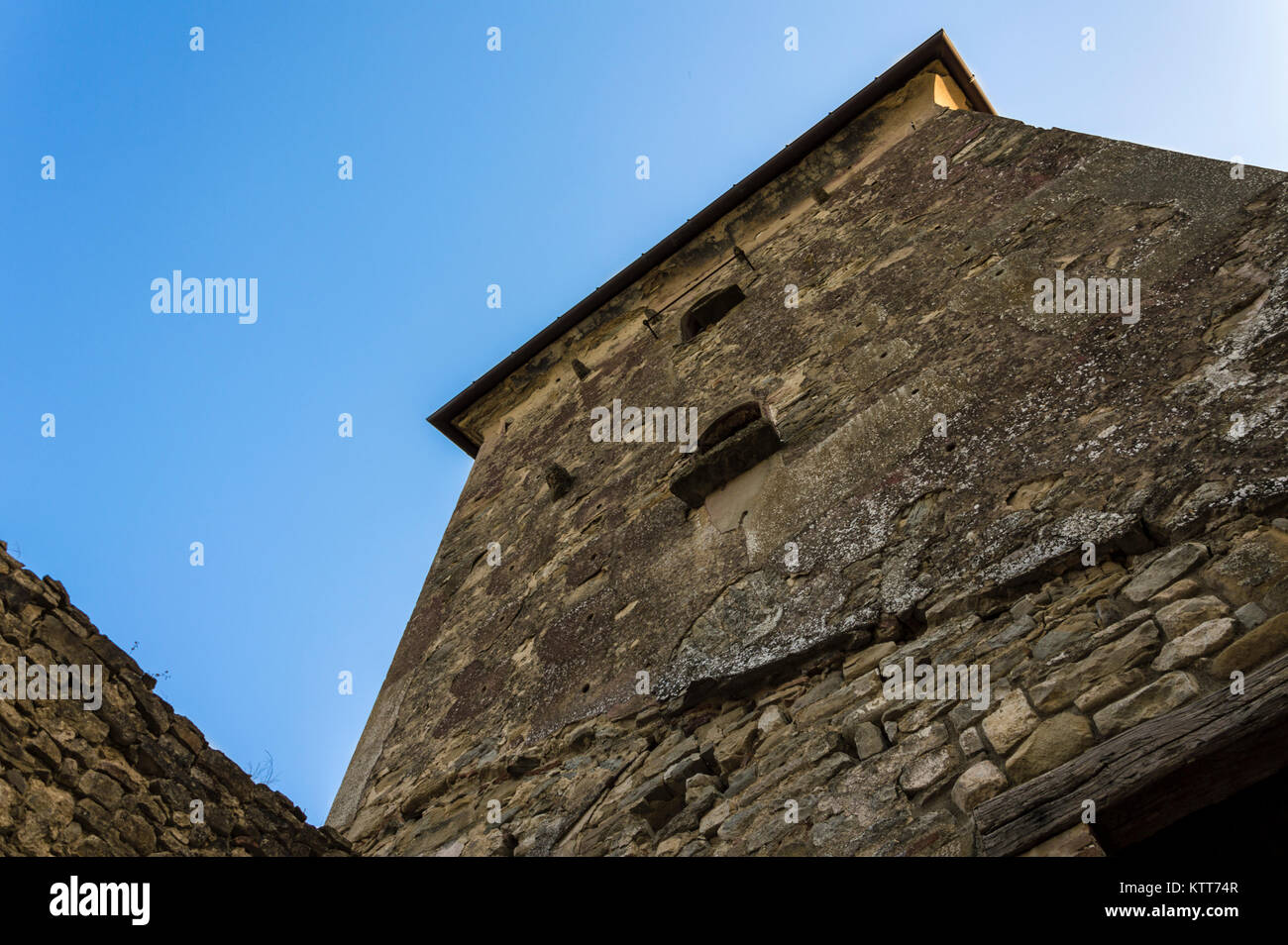 Detail of a dark ancient medieval tower Stock Photo - Alamy