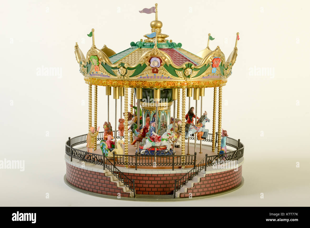 Old toy carousel on white background Stock Photo - Alamy