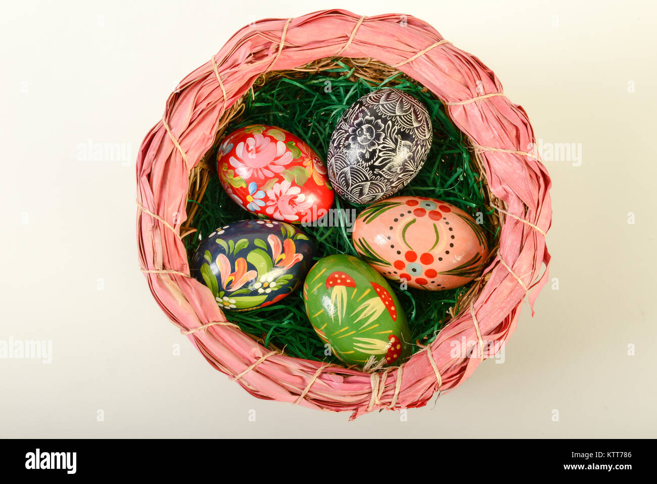 Top View of Easter Eggs in Basket on white Background Stock Photo - Alamy