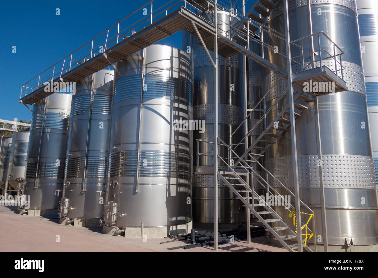 Stainless steel silos in the industry, for storage Stock Photo - Alamy