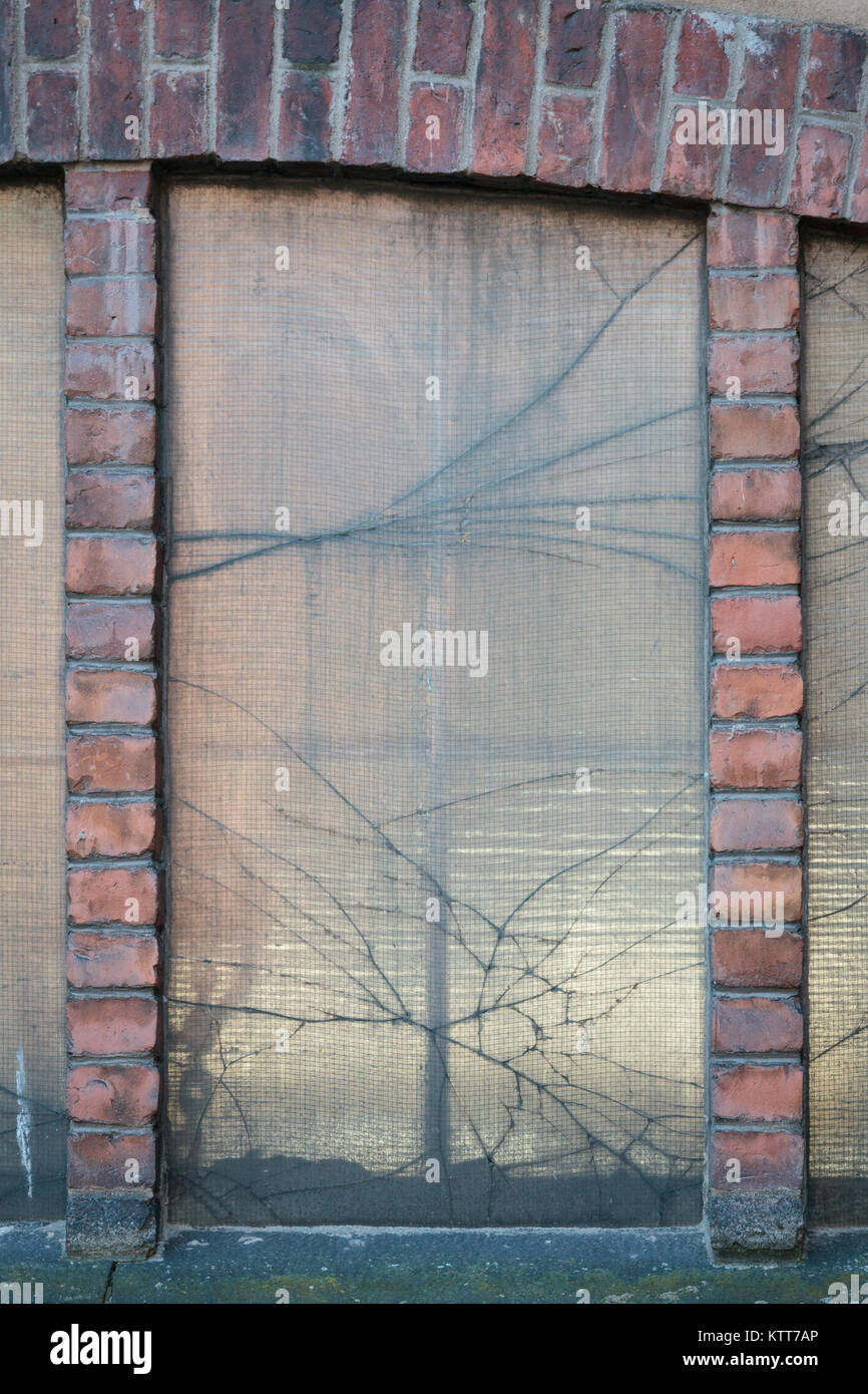 Broken window in old factory building Stock Photo - Alamy