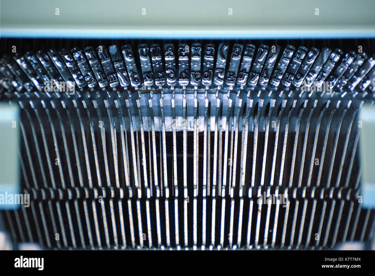 Typewriting machine detail. Metal letters forming a row. Empty copy ...
