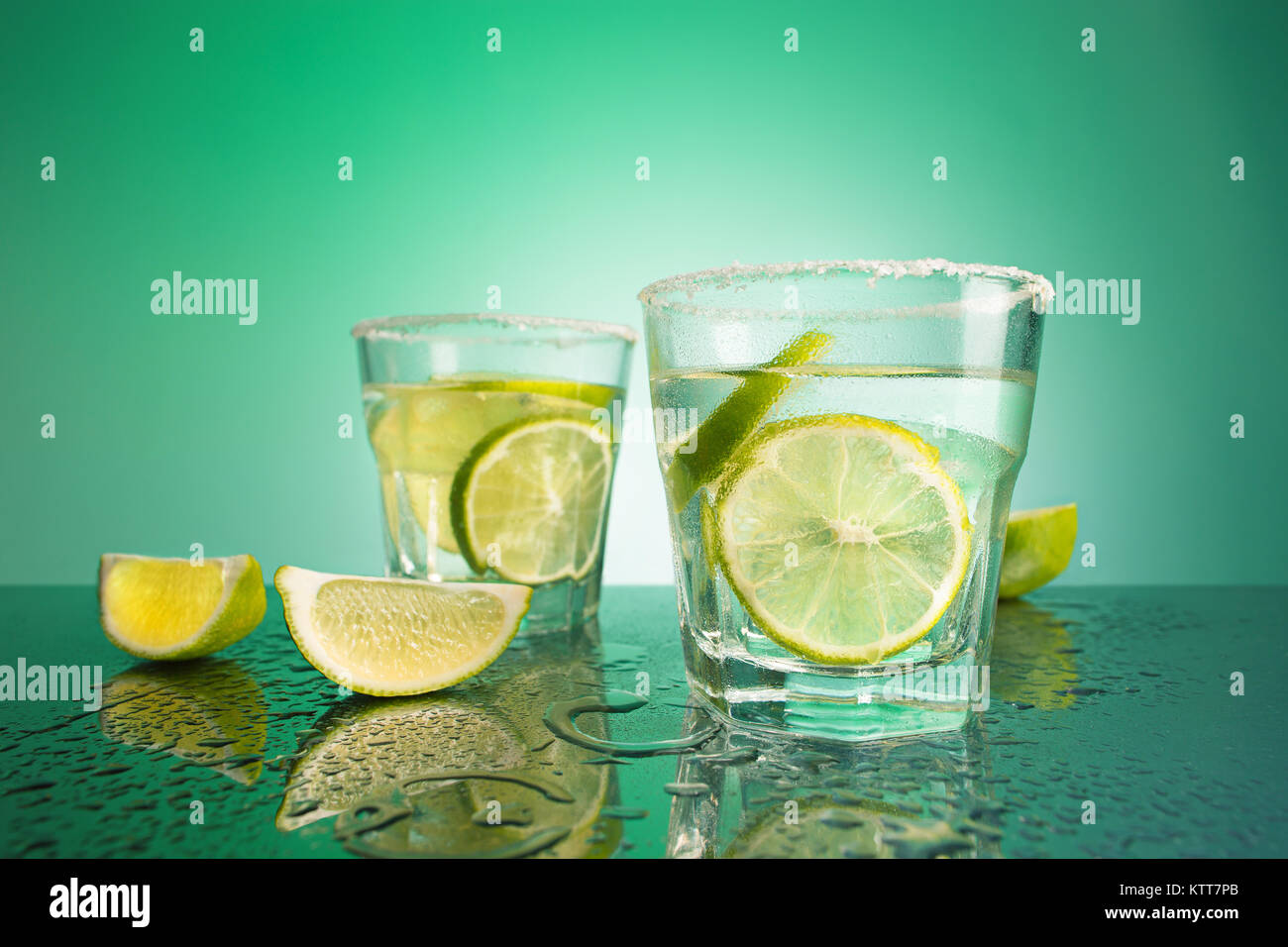 The closeup of a cape cod cocktail or vodka with fruits on blue studio ...