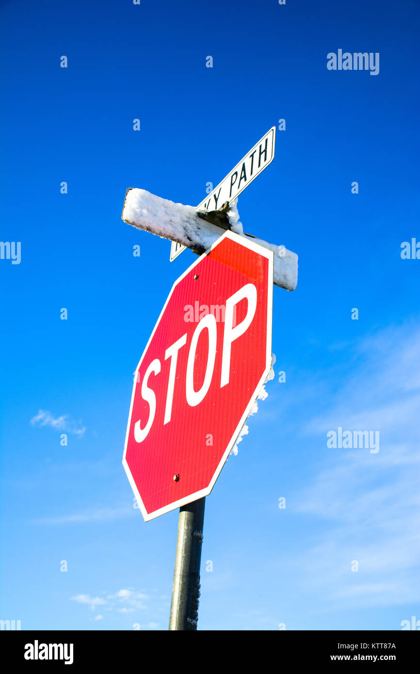 Stop sign with snow Stock Photo - Alamy