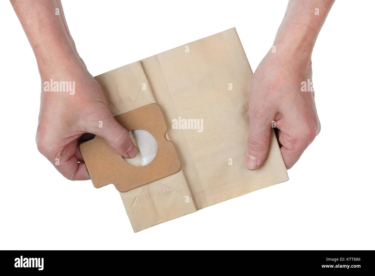 A new paper bag for dust from a vacuum cleaner in the hands of an ...