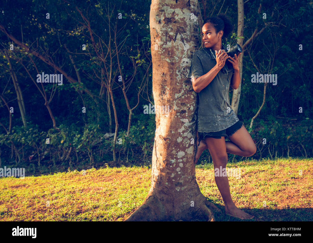 Woman Hiding Behind Tree