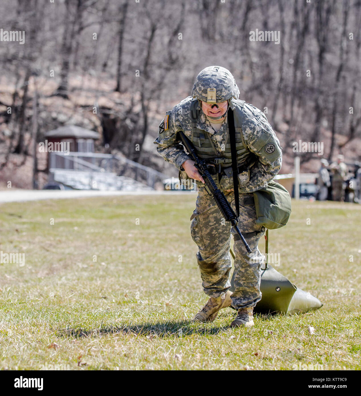 A Soldier runs through the stress shoot lane combining physical tests ...