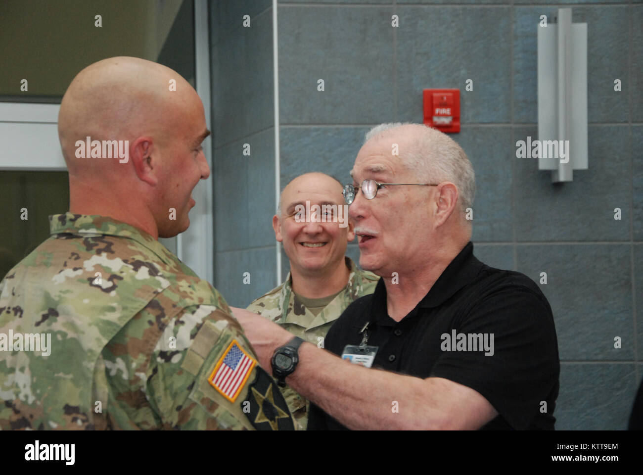 Chief Warrant Officer 2 Matthew Starr is congratulated following his ...