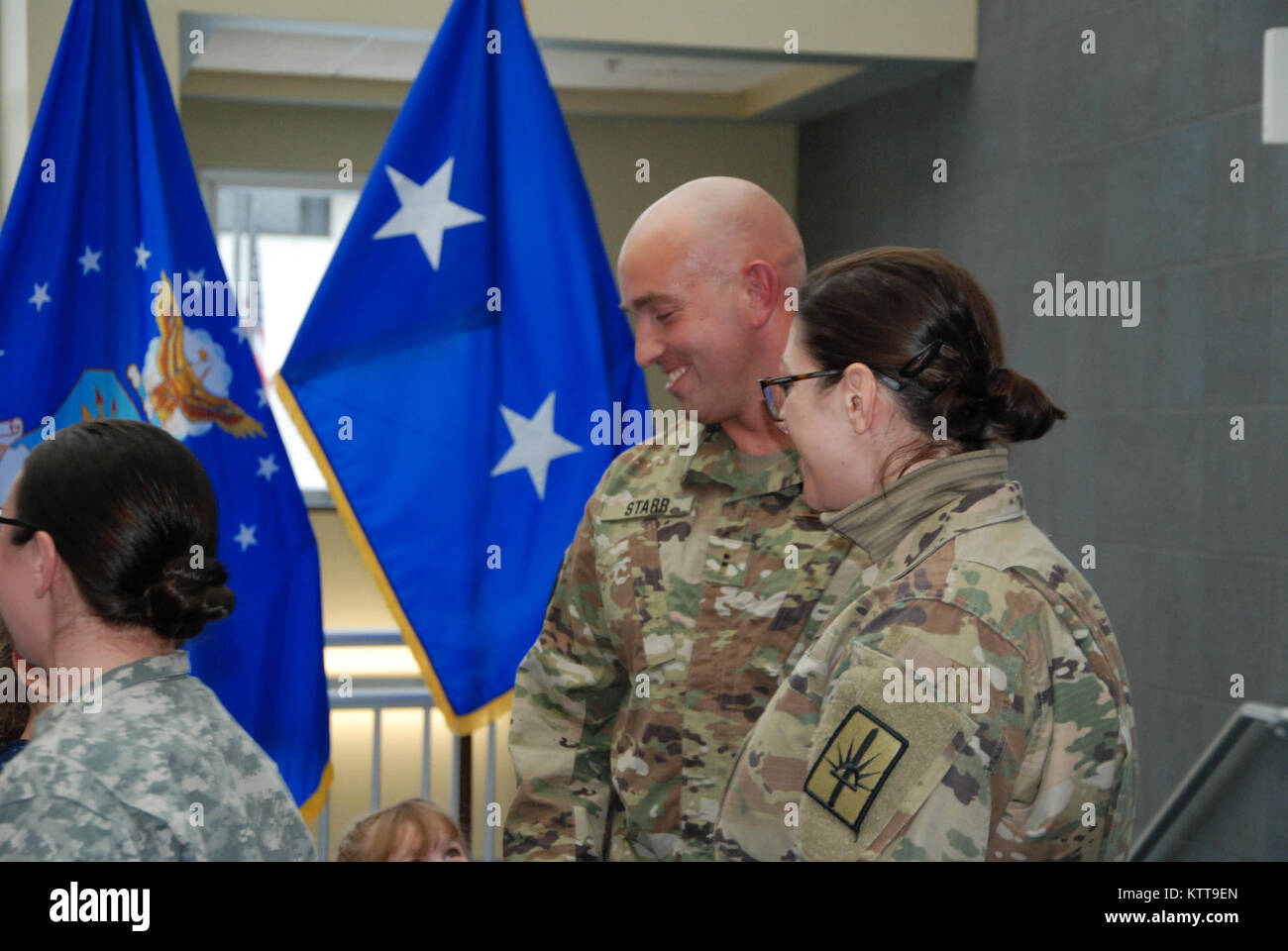 Chief Warrant Officer 2 Matthew Starr is congratulated following his ...