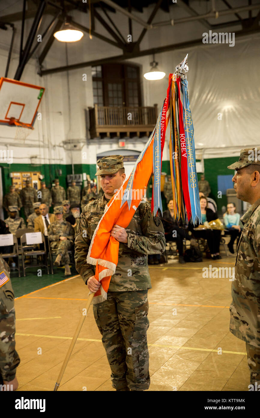 U.S. Army Maj. Ian Seagriff holds the battalion colors as he assumes ...