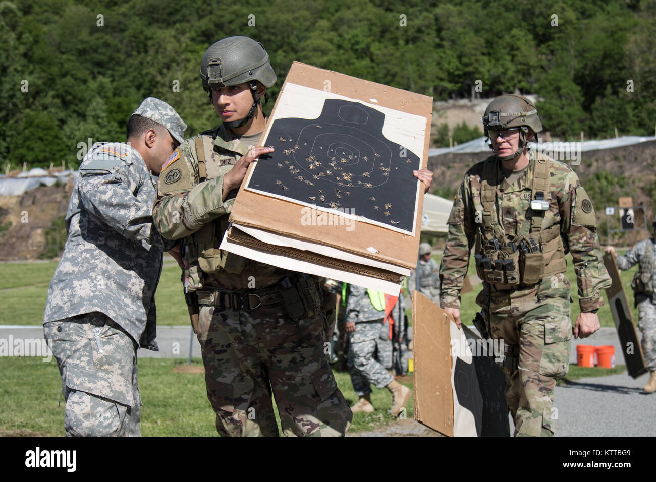 New York Army National Guardsmen wait to hand in their targets during ...