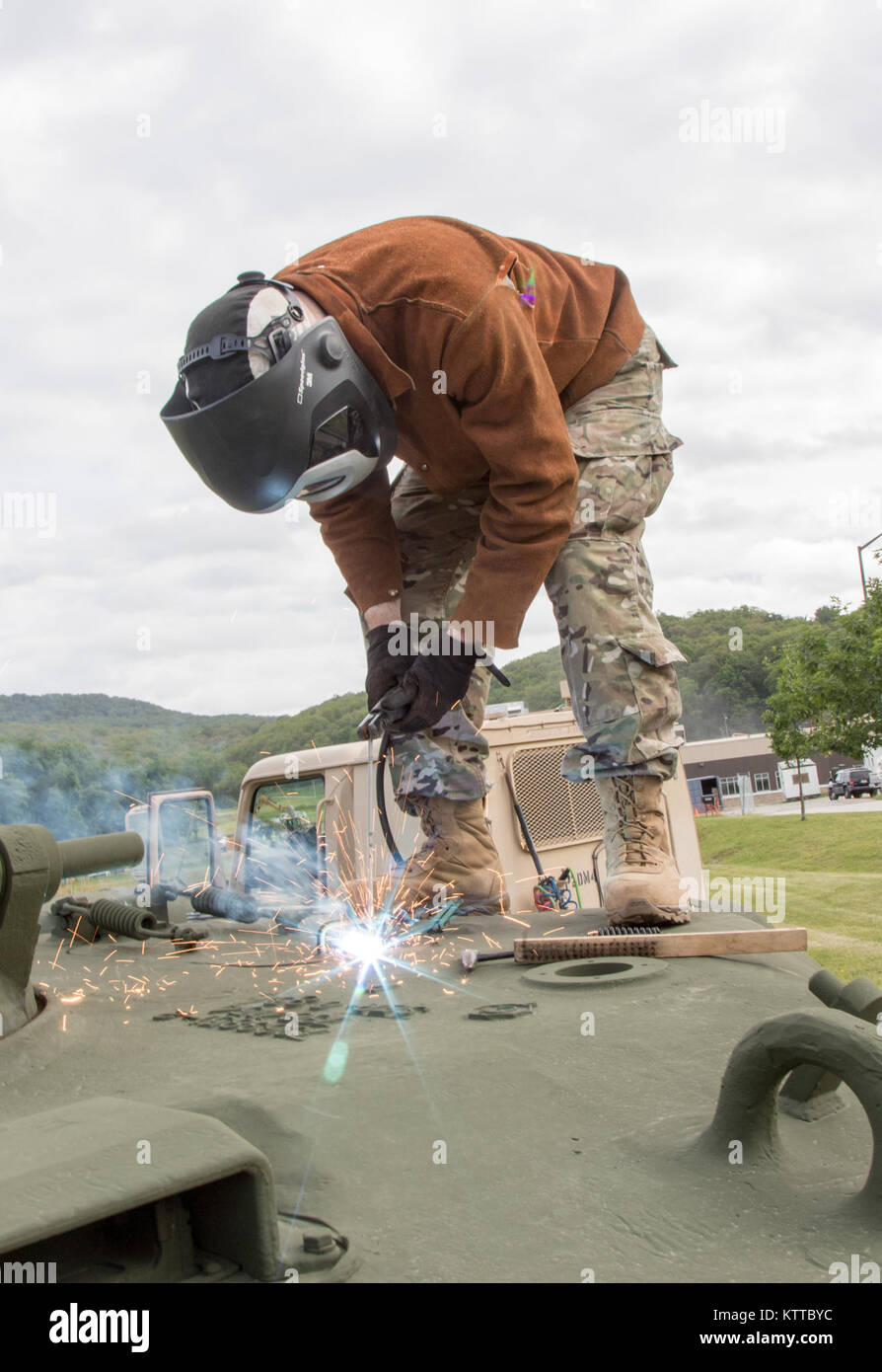 U.S. Army Staff Sgt. Cory Peck, a welder for the New York Maneuver Area ...