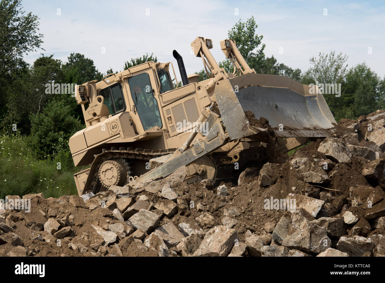 U.S. Army Soldiers with the 204th Engineer Battalion Detachment work on ...
