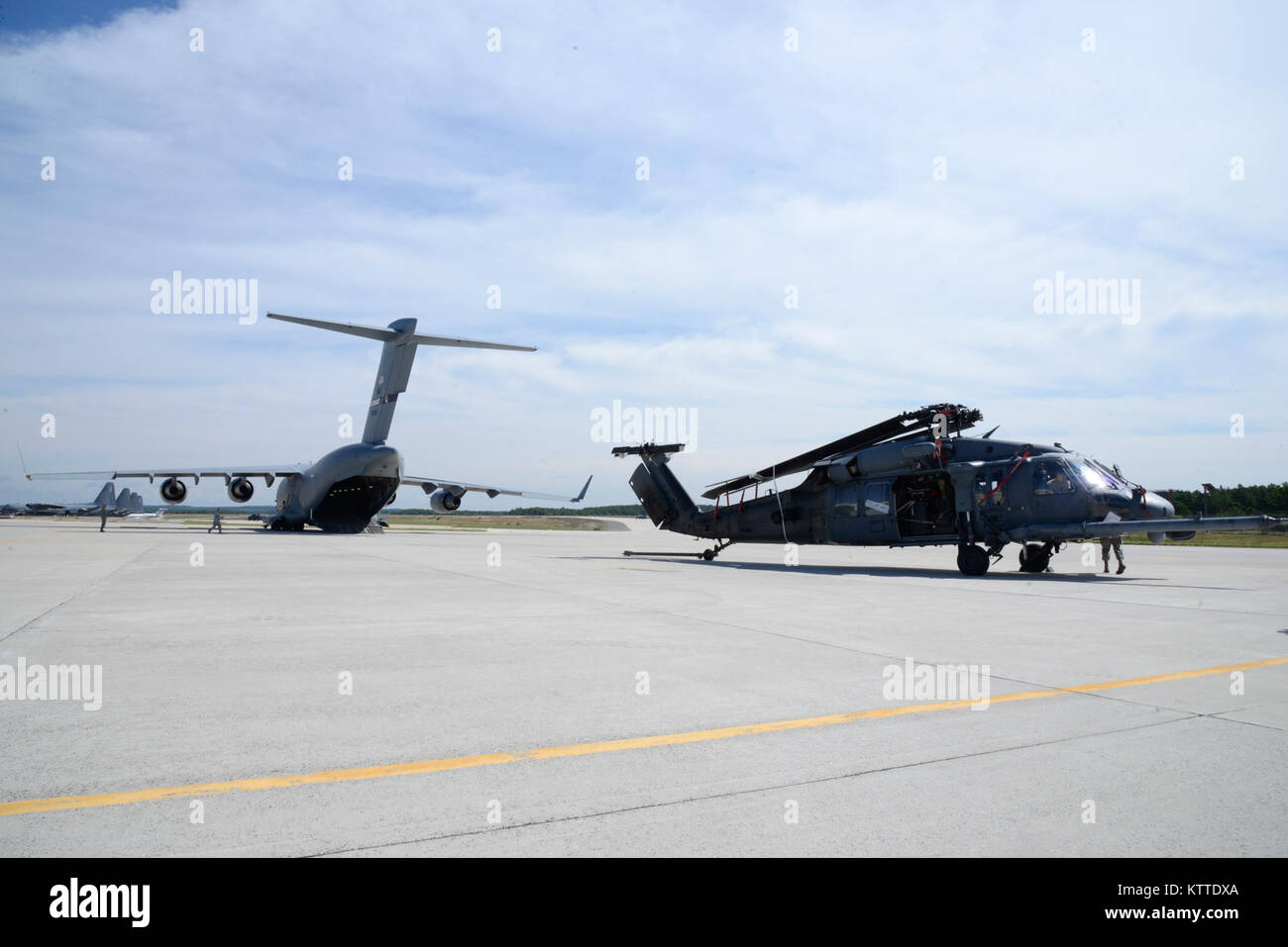 Airmen assigned to the 105th Airlift Wing and 106th Rescue Wing load ...